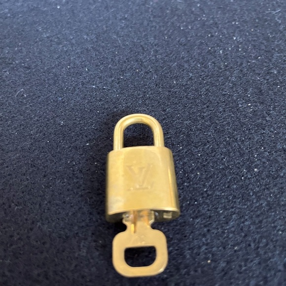 Louis Vuitton | Other | Authentic Lv Lock And Key Bag Charm | Poshmark